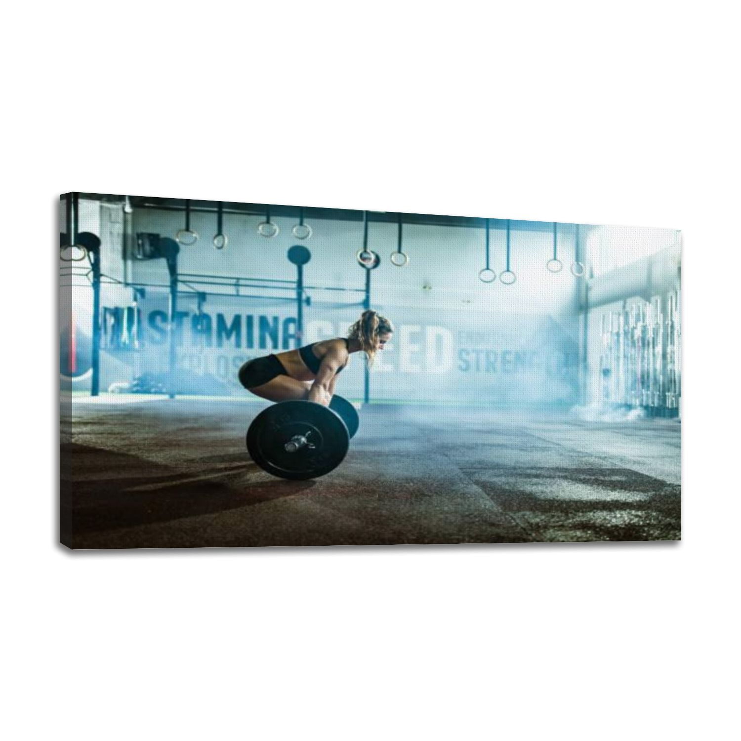 Canvas Wall Art Side view athletic woman exercising deadlift gym Wall ...
