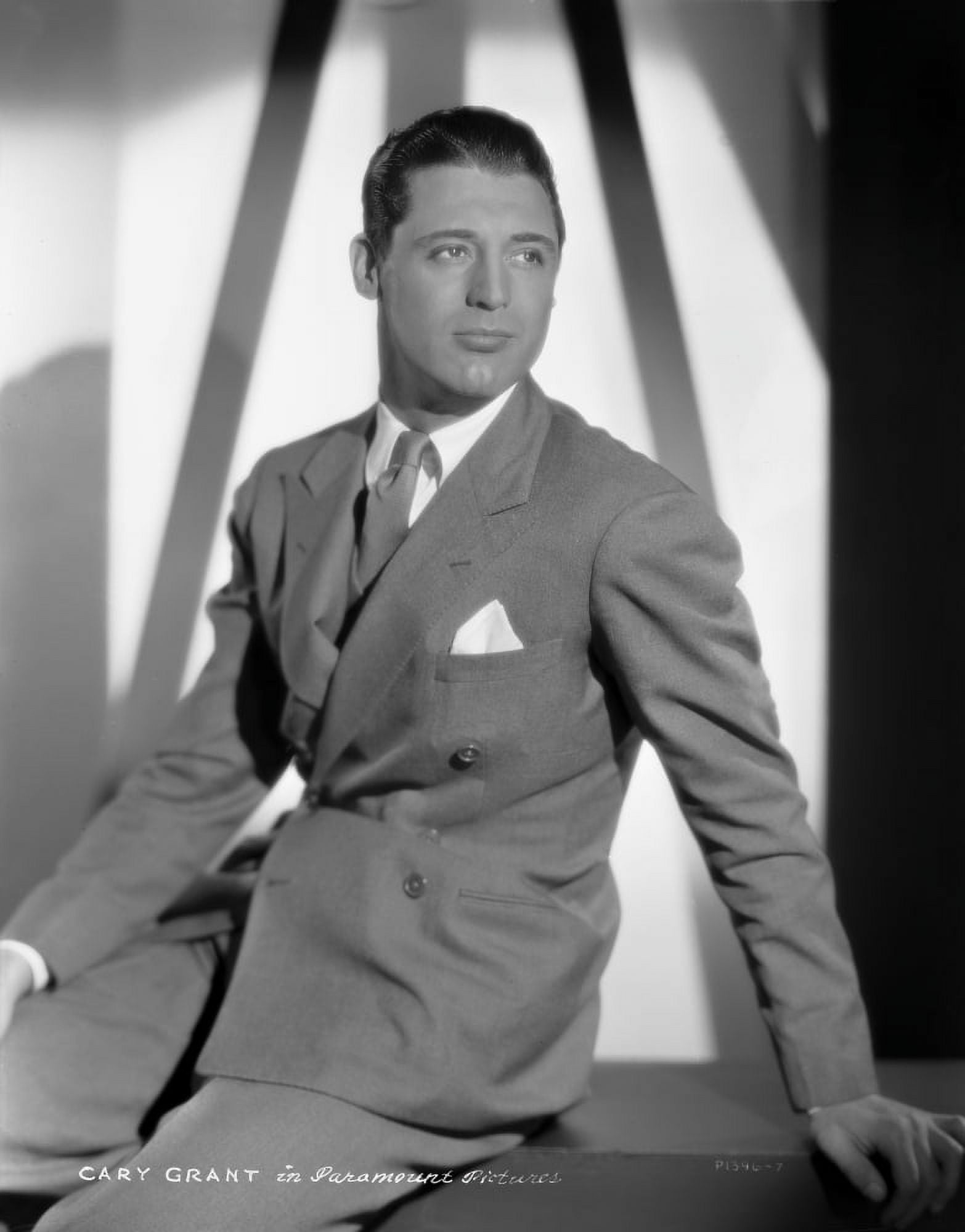 Cary Grant in a suit sitting down with a pocket chief H Photo Print (24 ...