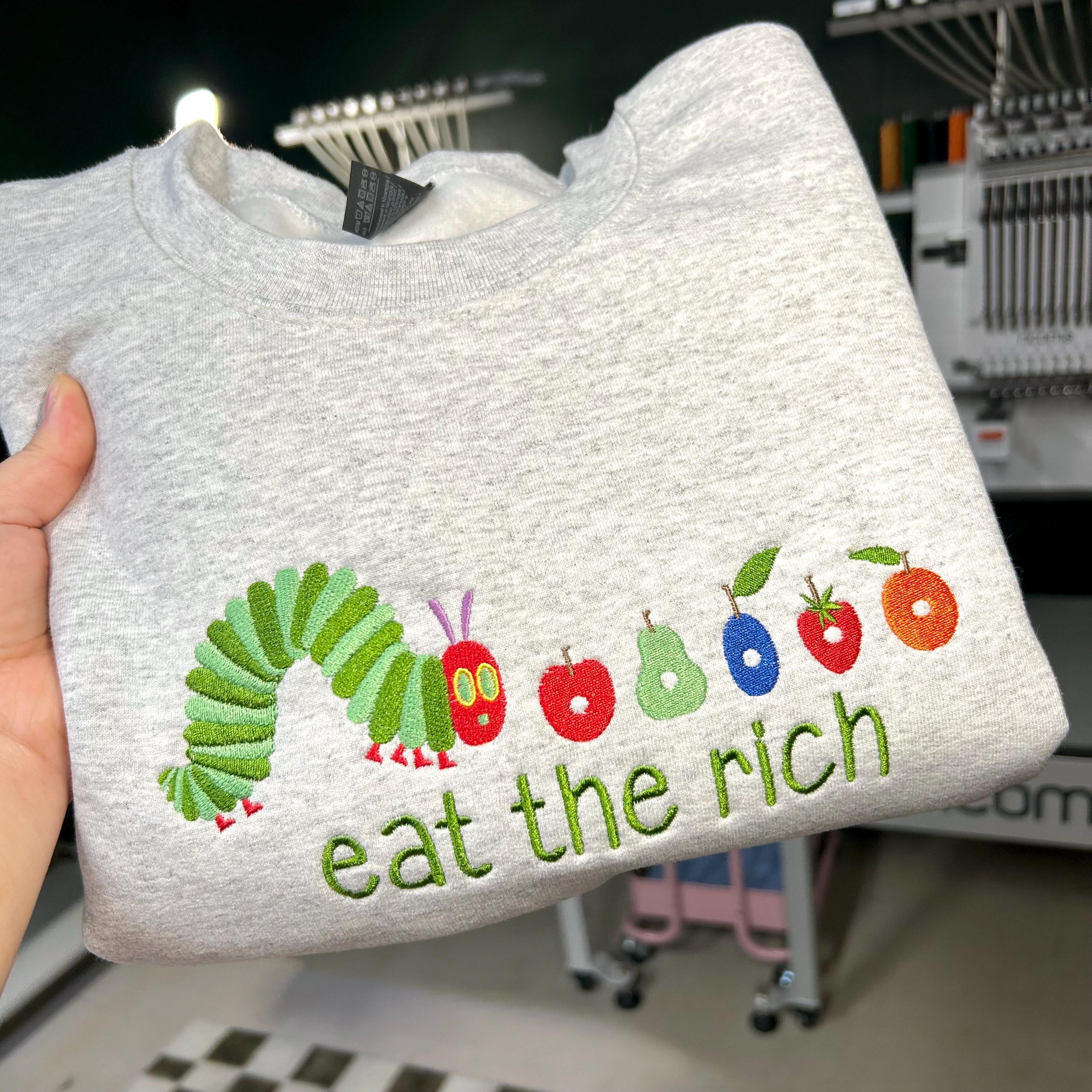 Caterpillar “eat the rich” Embroidered Crewneck | Human Rights Shirt ...