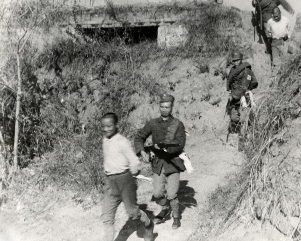 Chinese Communist Soldiers Are Taken From A Tower Captured By Government Forces. The Fighting ...