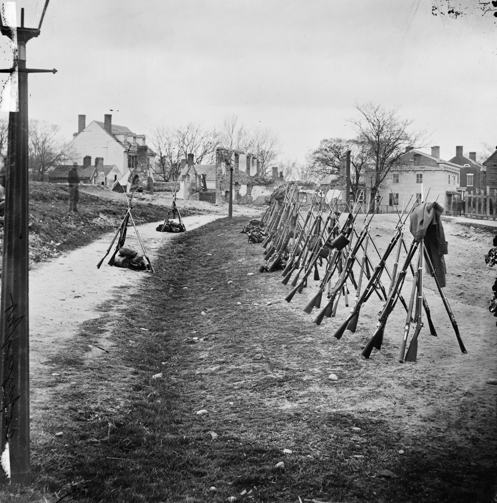 Civil War Stacked Rifles. Nrow Of Stacked Union Rifles With Houses In ...
