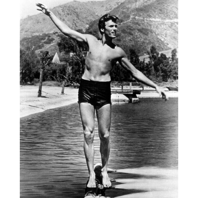 Clint Eastwood beef cake full length in swim shorts 1960's by ocean ...