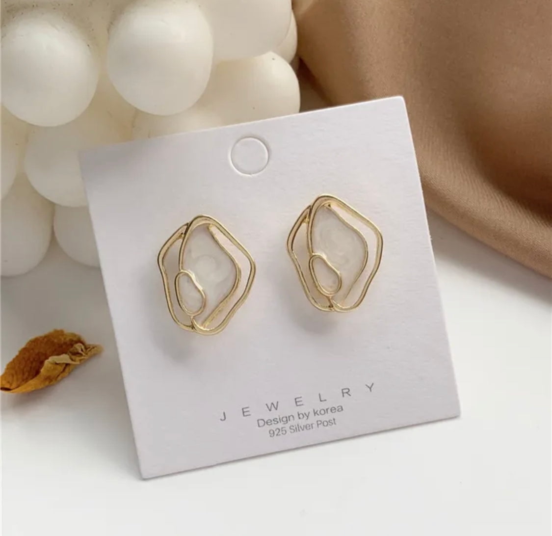Clip on 1" gold and center white odd shaped button style earrings ...