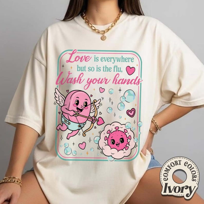Comfort Colors Ivory T-Shirt with Pink Cupid Graphic & "Love is ...