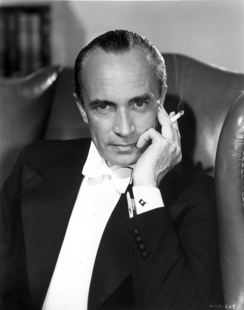 Conrad Veidt sitting in Black Coat with Cigarette in His Hand Photo ...