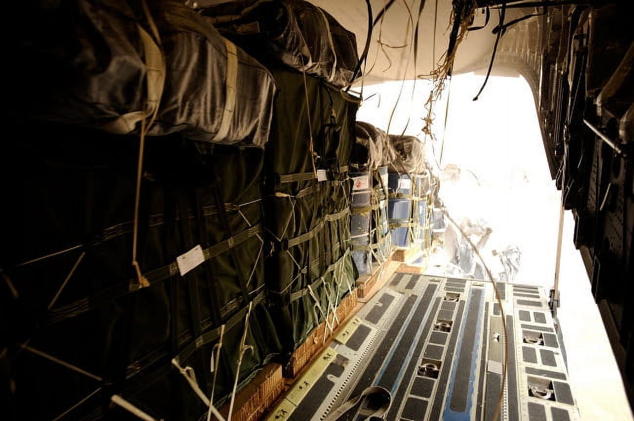Container delivery system bundles drop out of a C-17 Globemaster III ...