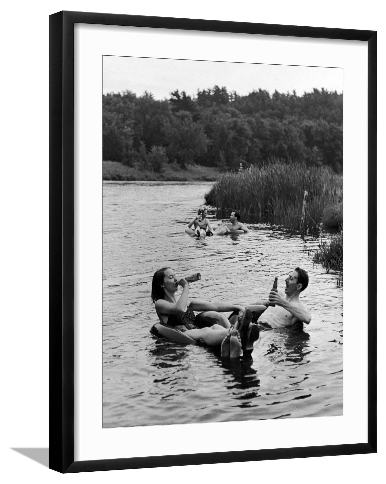 Art.com Couple Drinking Beer at Inner Tube Floating Party on the Apple ...