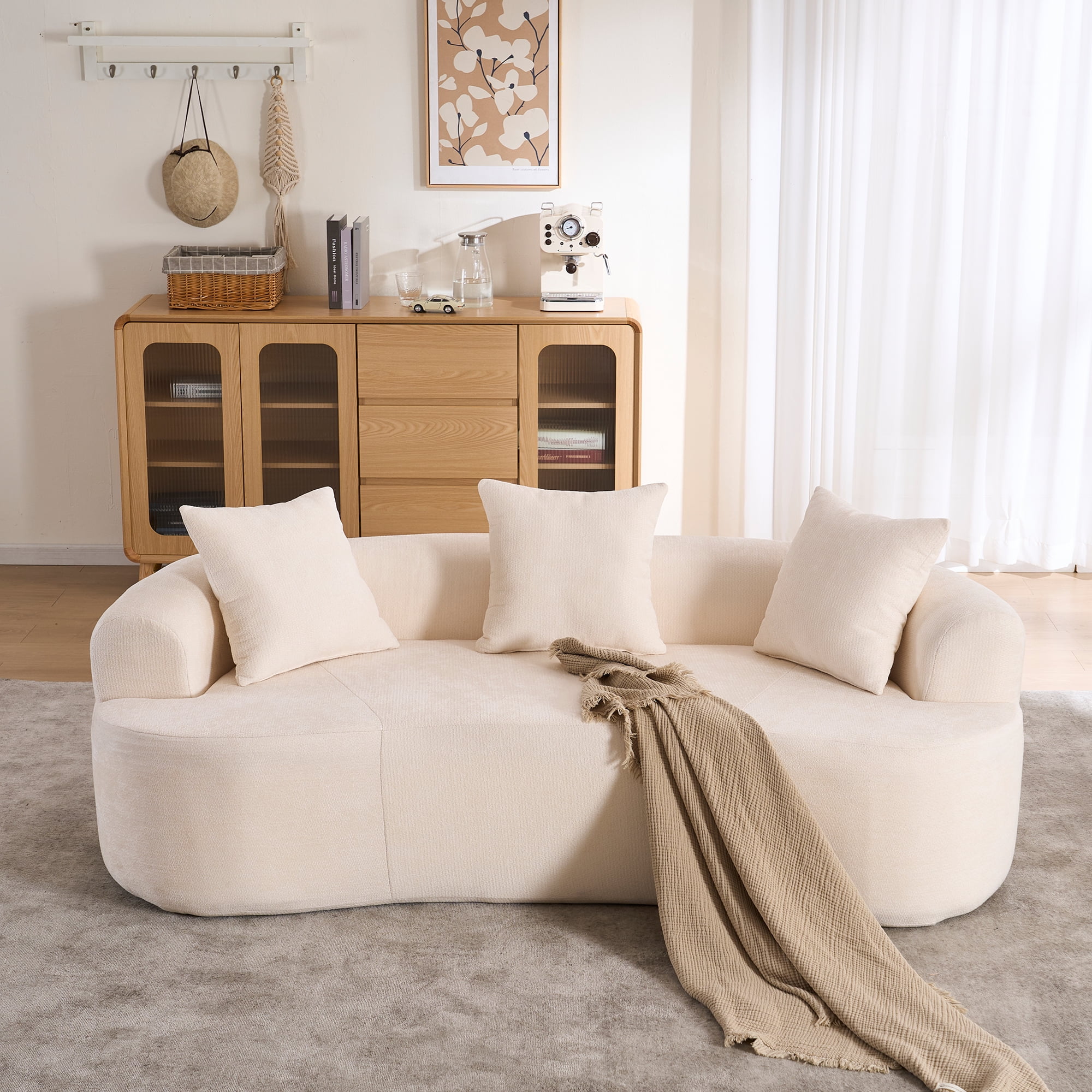 Crescent-shaped sofa, modern low-back design with deep cushions, self ...