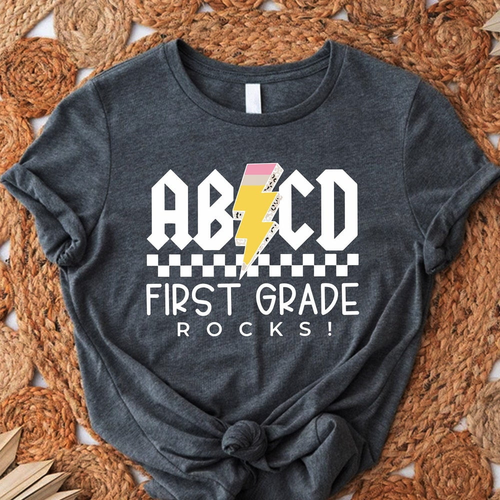 DOPASHIRT Abcd 1St Grade Rocks Teacher Shirt, First Grade Teacher ...