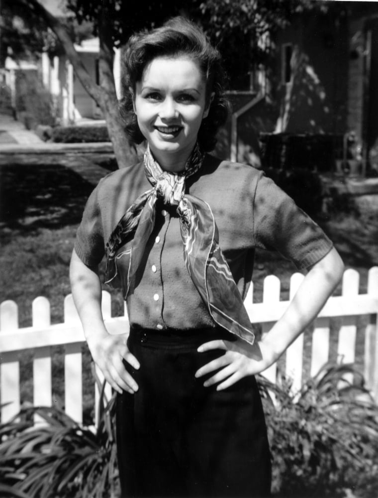 Debbie Reynolds standing with Hands on Hips in Black and White Photo ...