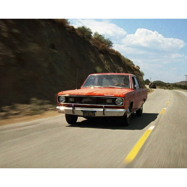 Dennis Weaver In Duel Driving Plymouth Valiant Down Road Truck Looming ...