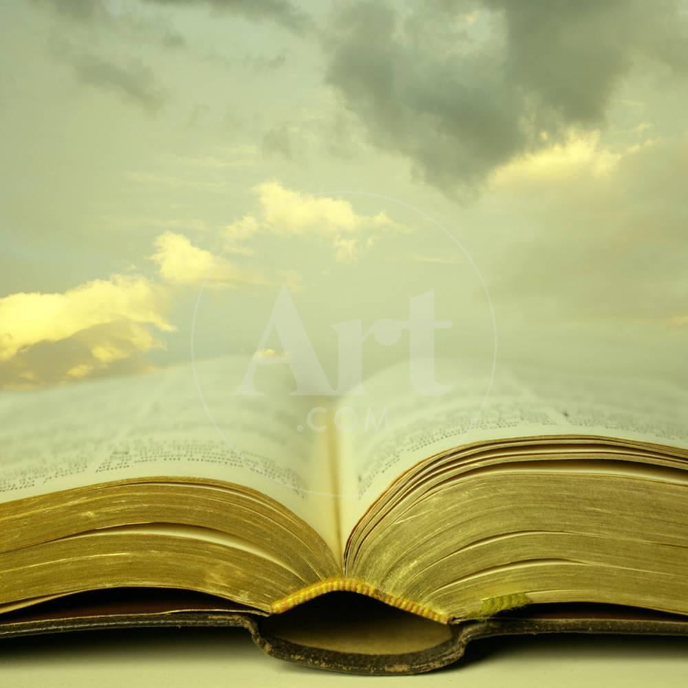 Detail of an Old Holy Bible Open with a Beautiful and Mystical Sky in ...