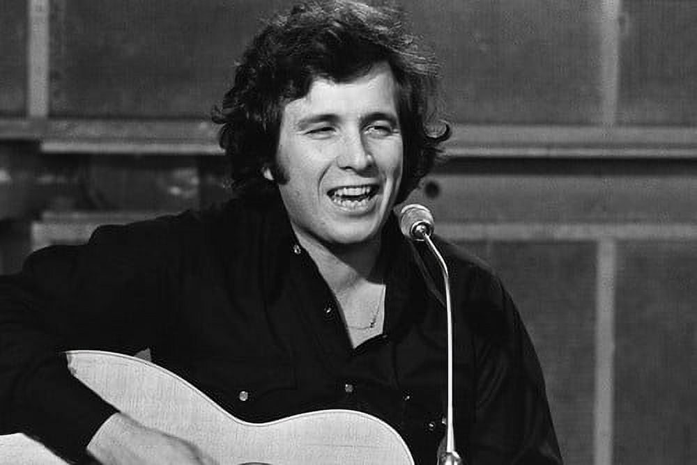 Don McLean iconic singer in black shirt singing playing guitar 1970's ...