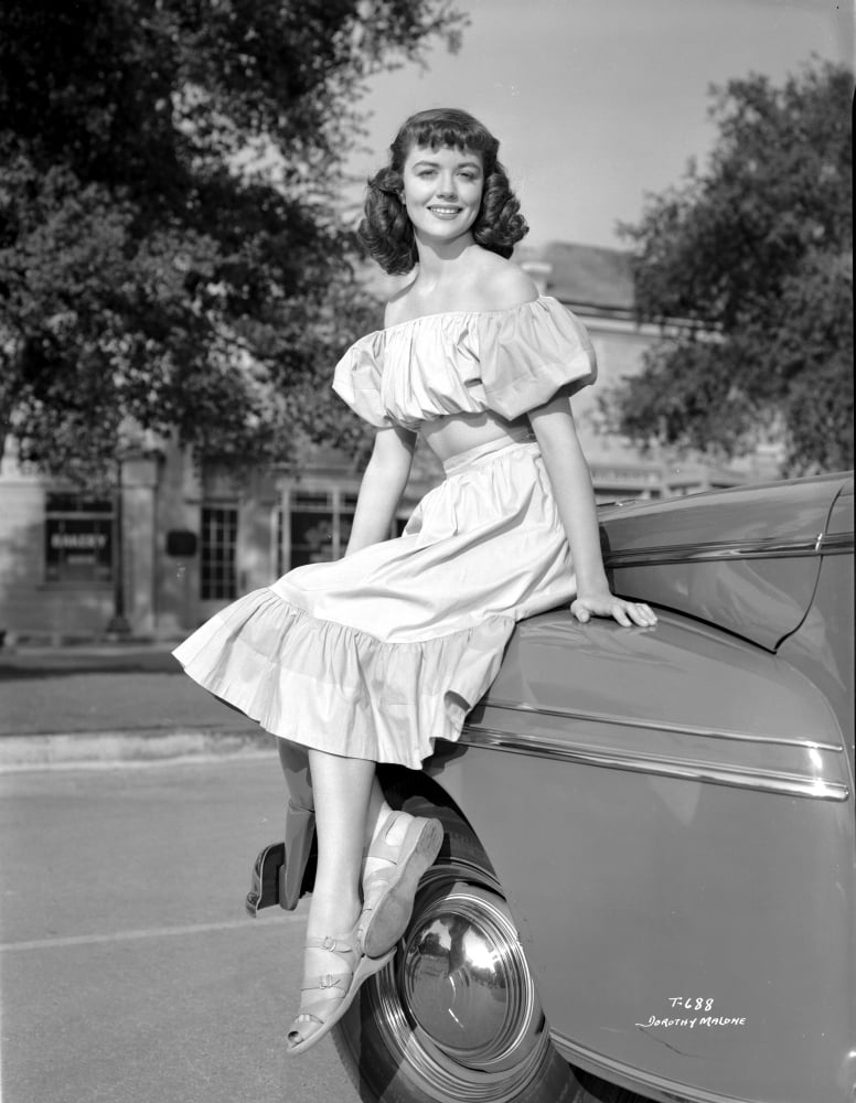 Dorothy Malone on a Ruffled Dress sitting on a Vintage Car Photo Print ...