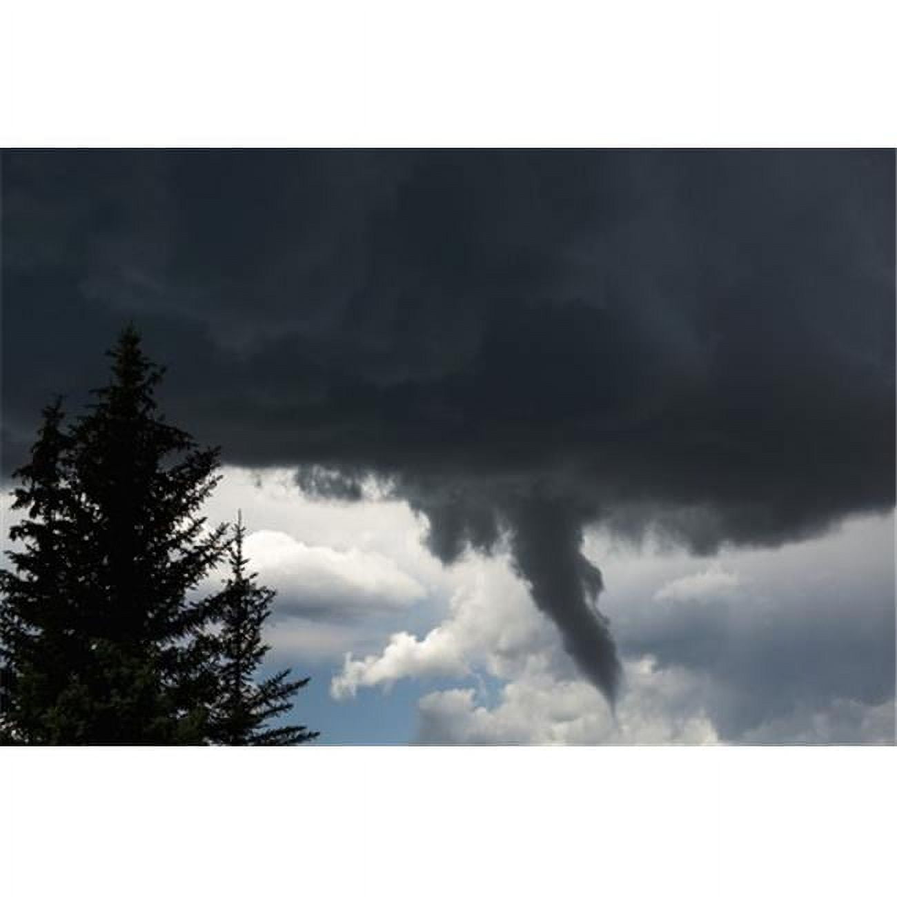 Dramatic Funnel Cloud Created in Dark Storm Clouds with Silhouetted ...