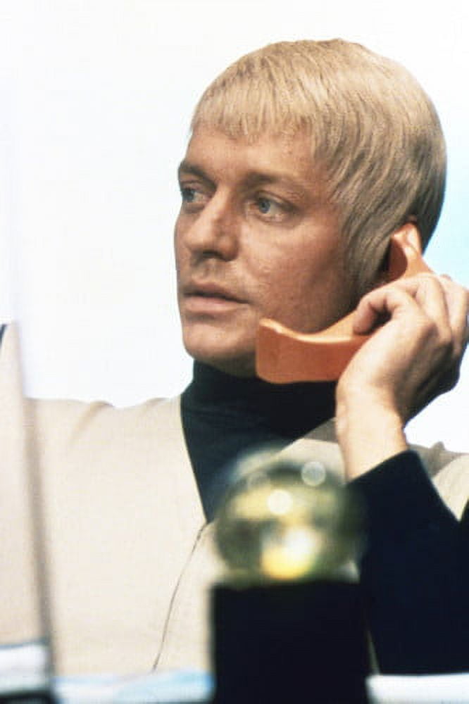 Ed Bishop in UFO as Ed Straker holding futuristic phone seated behind ...