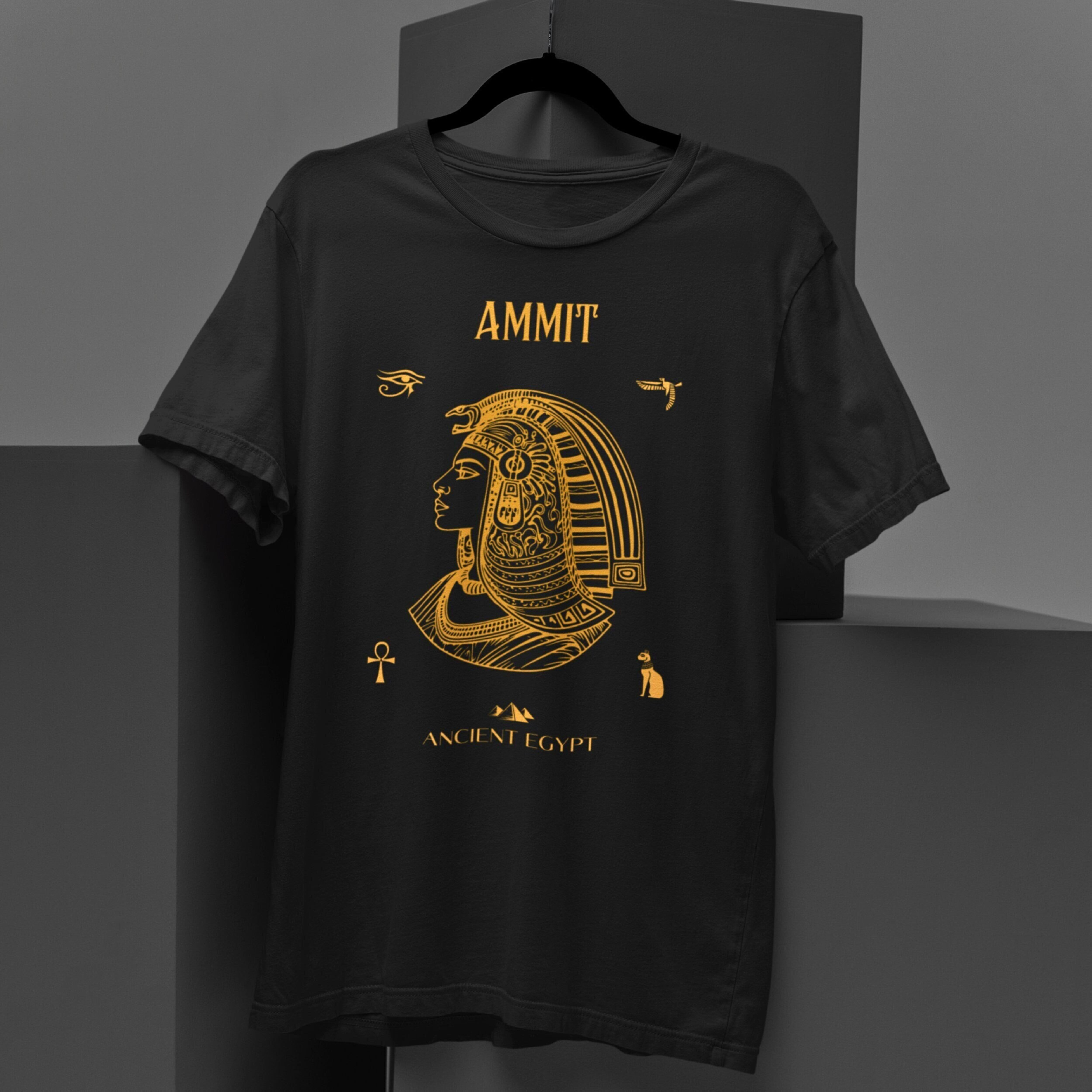 Egyptian T-shirt featuring the god Ammit in golden tones | Connect with ...