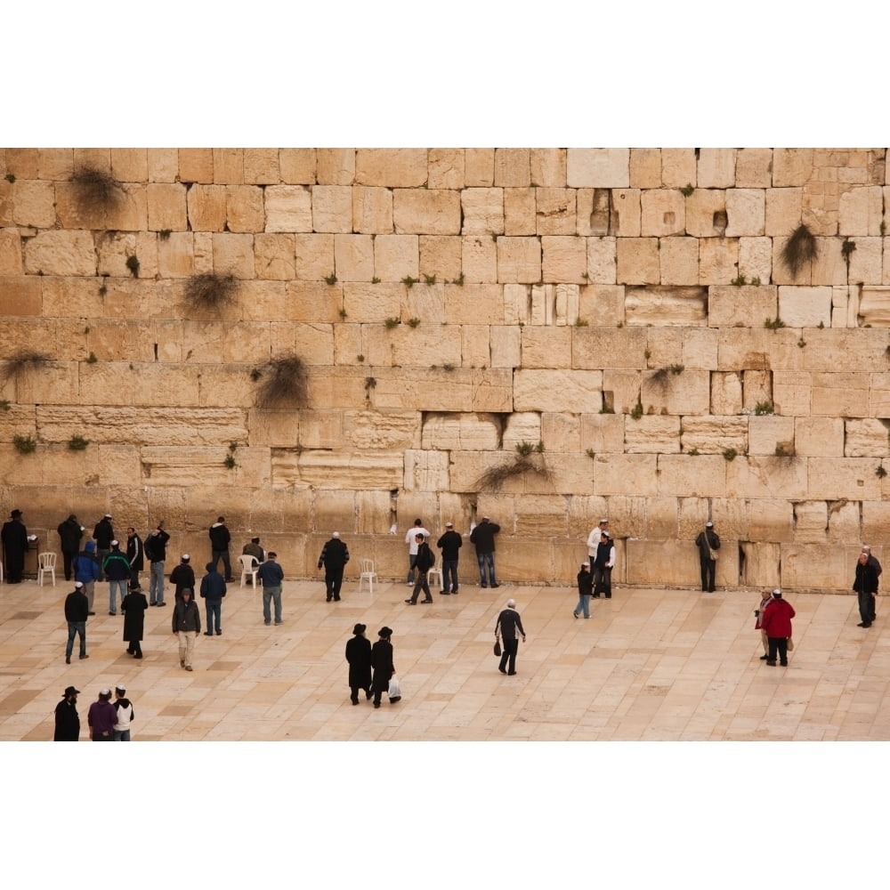 Elevated view of the Western Wall Plaza with people praying at the ...