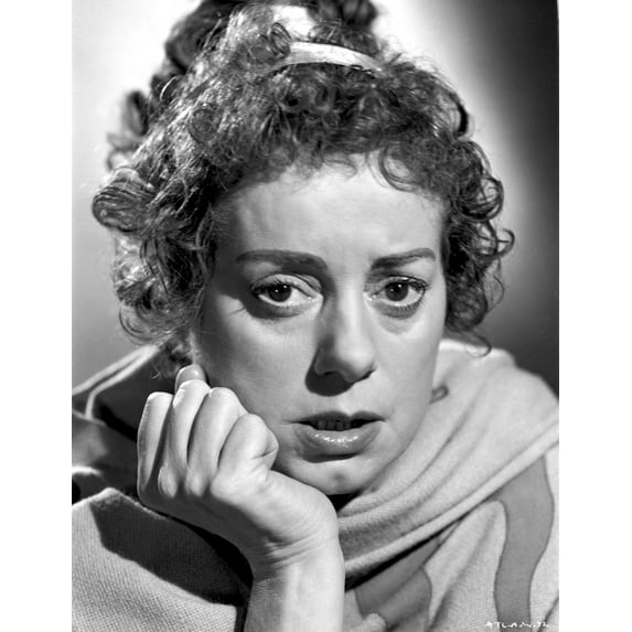 Elsa Lancaster on a Printed Top and Face Leaning on Closed Hands Photo ...