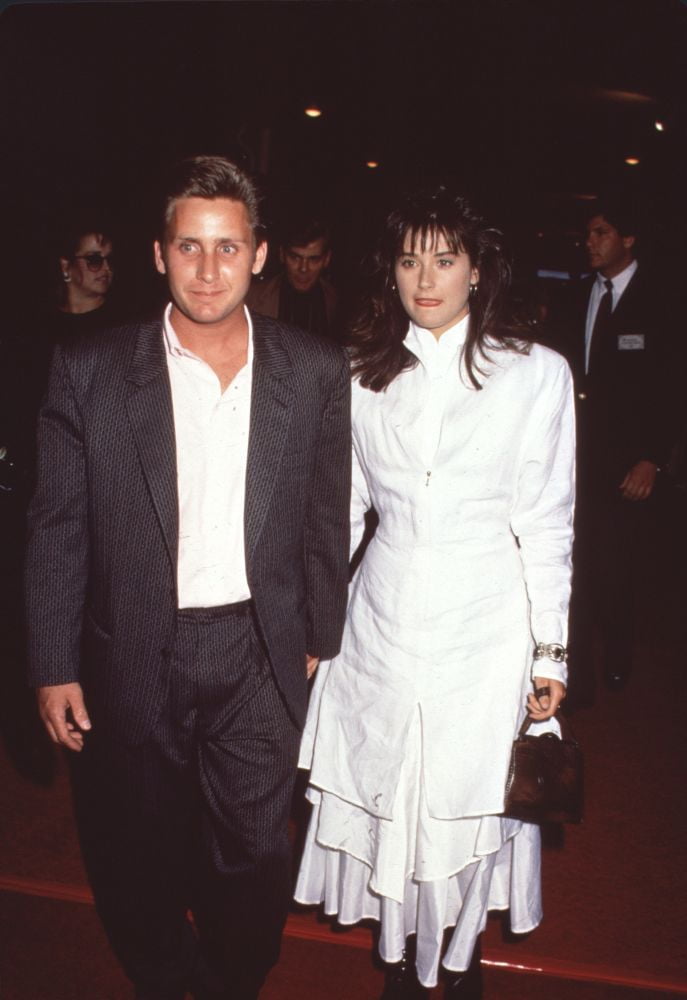 Emilio Estevez In Gray Suit And Demi Moore In White Ruffle Dress Photo ...