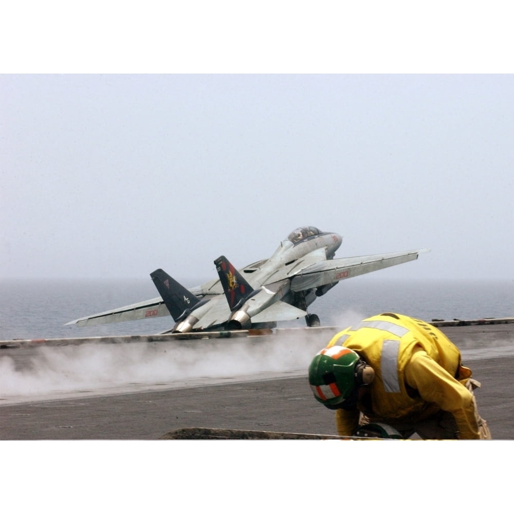F-14 Tomcat Fighter Launches From The Flight Deck Of The Aircraft ...