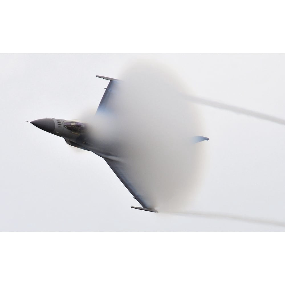 F-16 Fighting Falcon Creates A Vapor Cone Of Condensation As It Nears ...