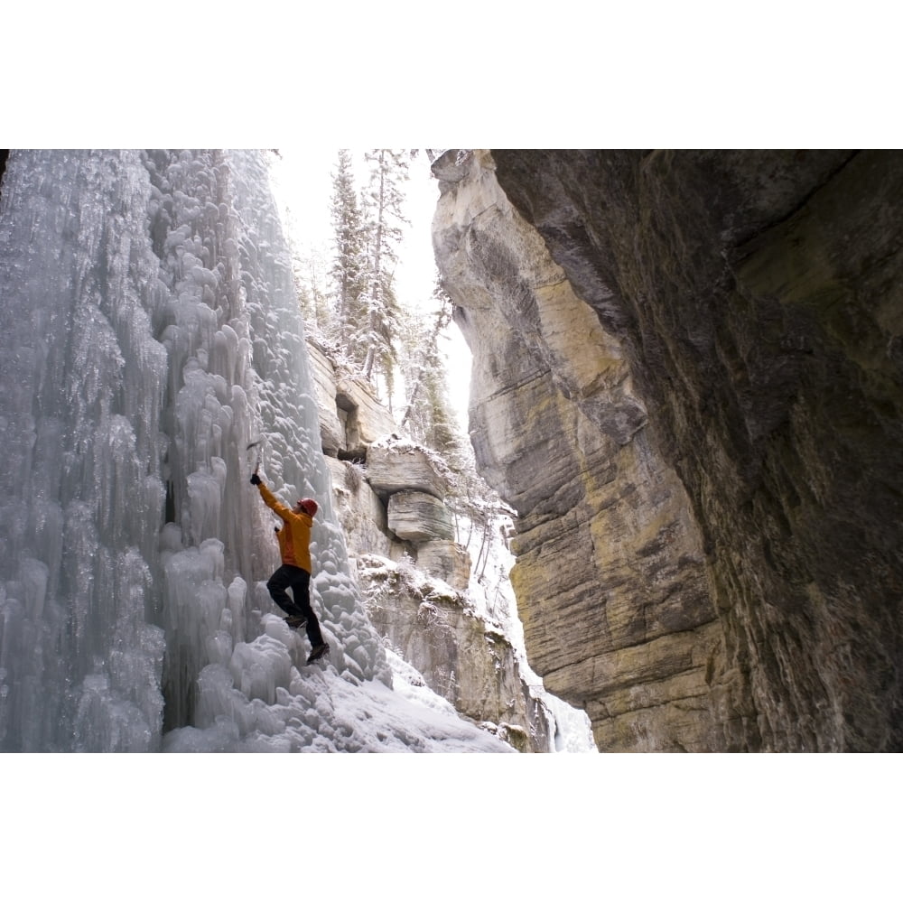Female Climber Explores Ice Climbing In The Narrows Of Maligne Canyon ...