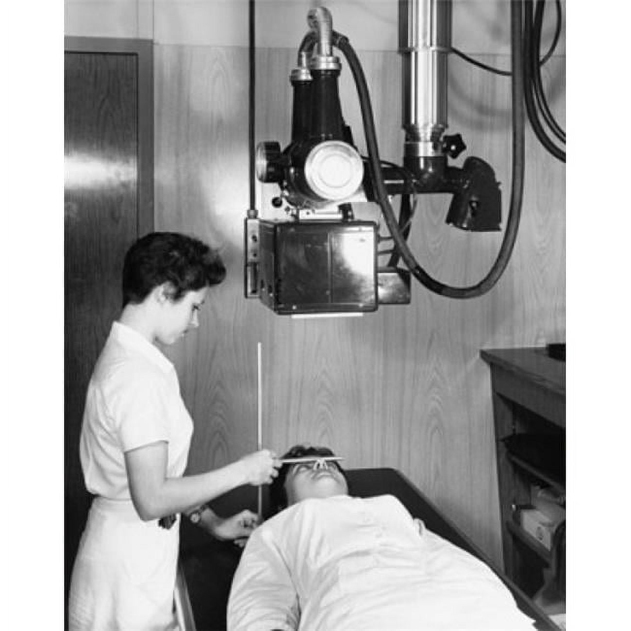 Female Radiologist Taking an X-Ray of a Patient Poster Print - 18 x 24 ...