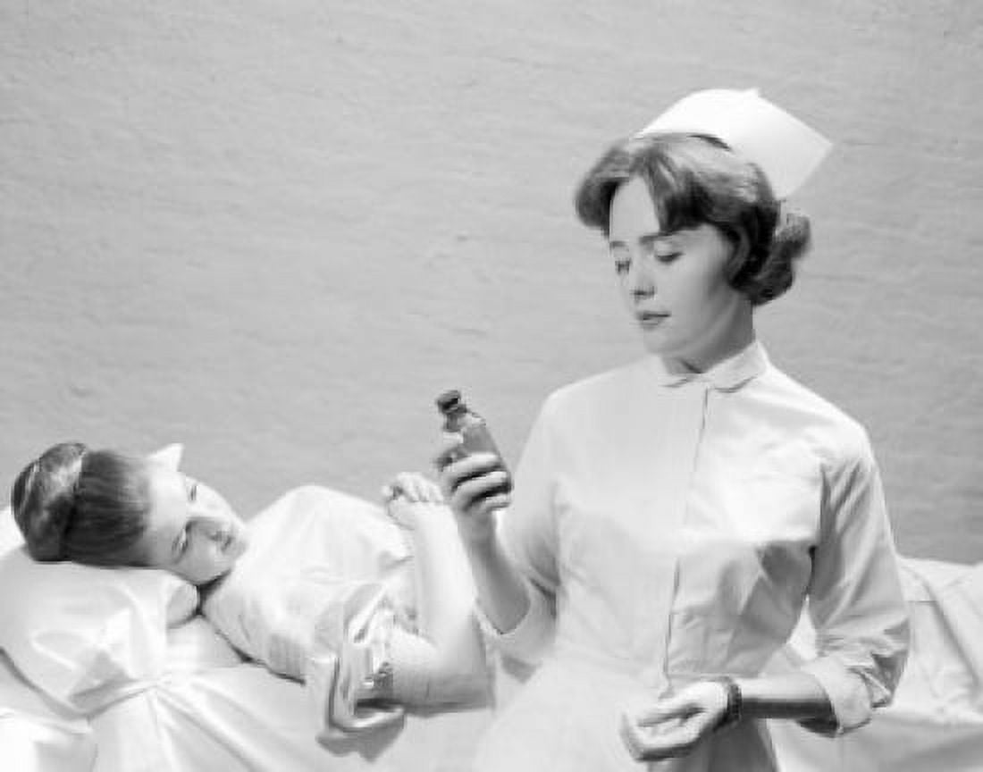 Female Nurse Giving Syrup To Patient Canvas Art 24 X 36
