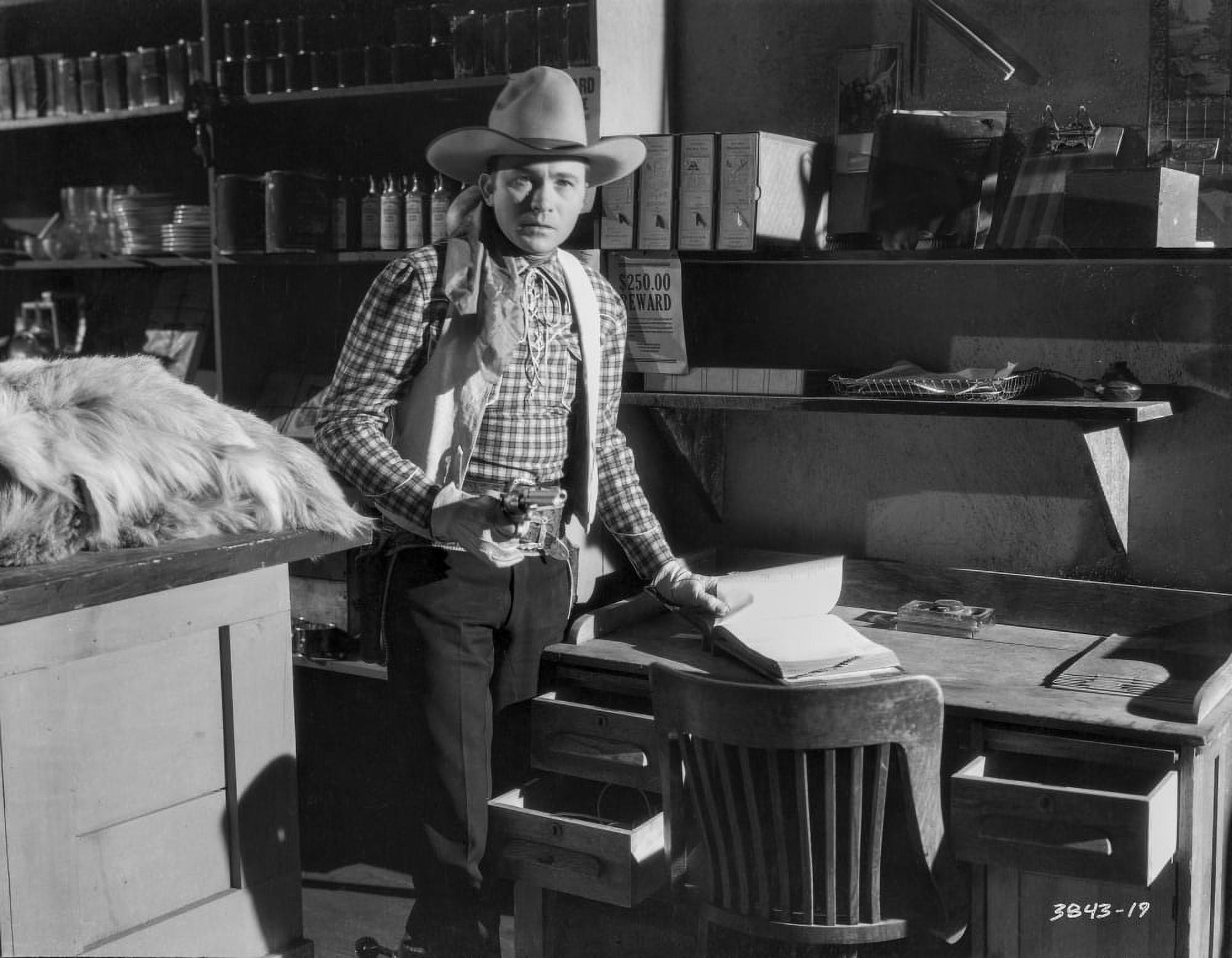 Film still featuring Tex Ritter in cowboy costume Photo Print (8 x 10 ...