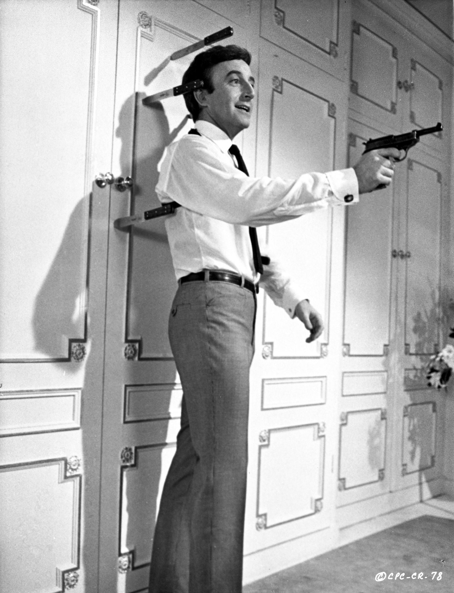 Film still of Peter Sellers holding a gun Photo Print (24 x 30 ...