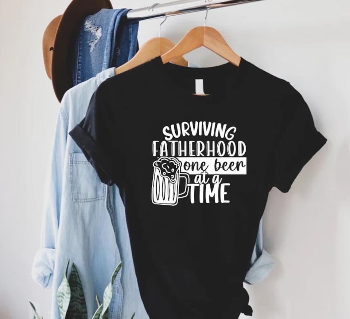 Funny Father Shirt, Fatherhood T-Shirt, Fathers Day Gift, Surviving ...