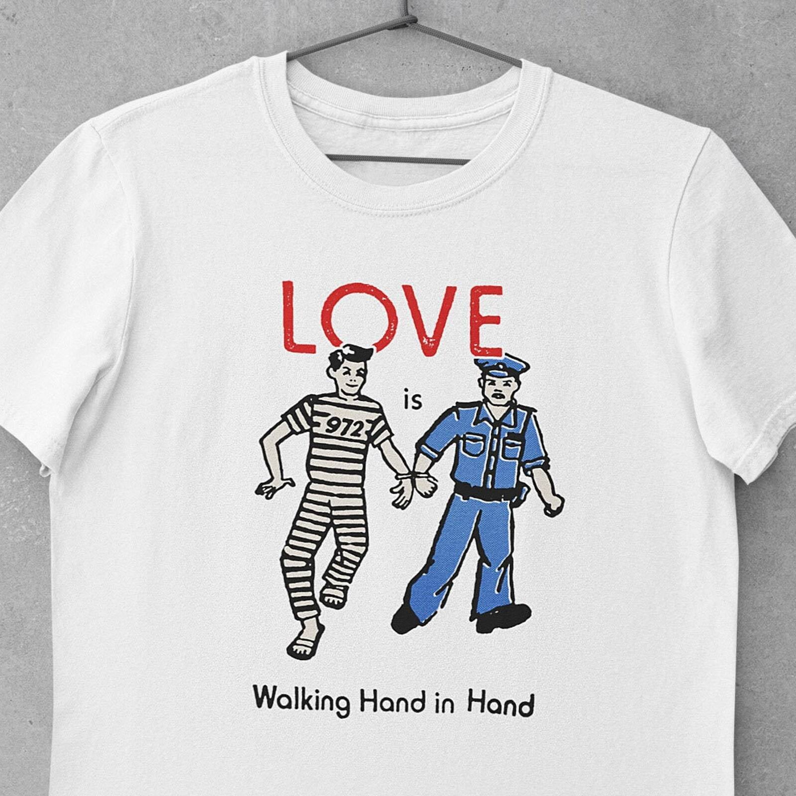 Funny Love Is Walking Hand In Hand Prisoner And Police In Handcuffs Pop ...