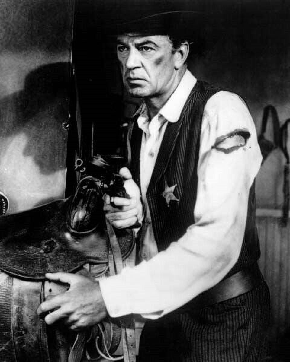 Gary Cooper as Will Kane in bullet torn shirt holding gun High Noon ...