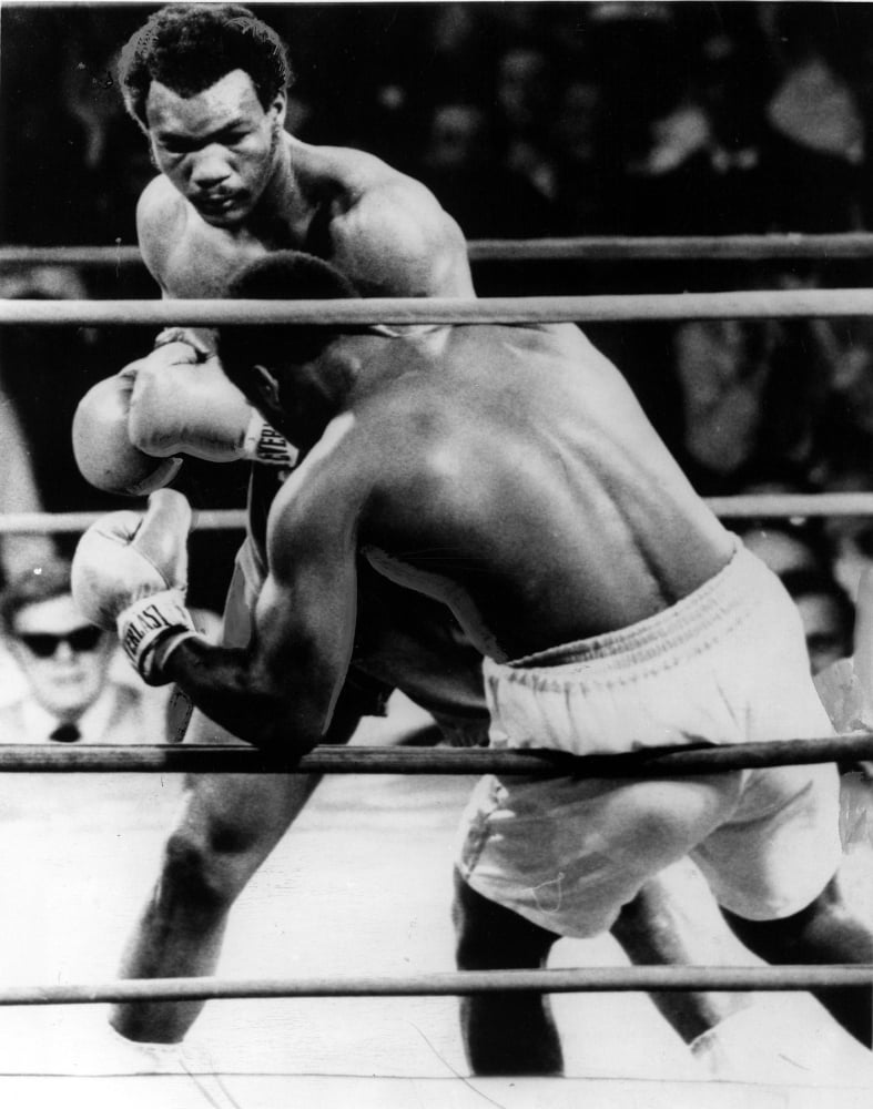 George Foreman- The Boxer Knocking Joe Frazier Down In The Second Round ...