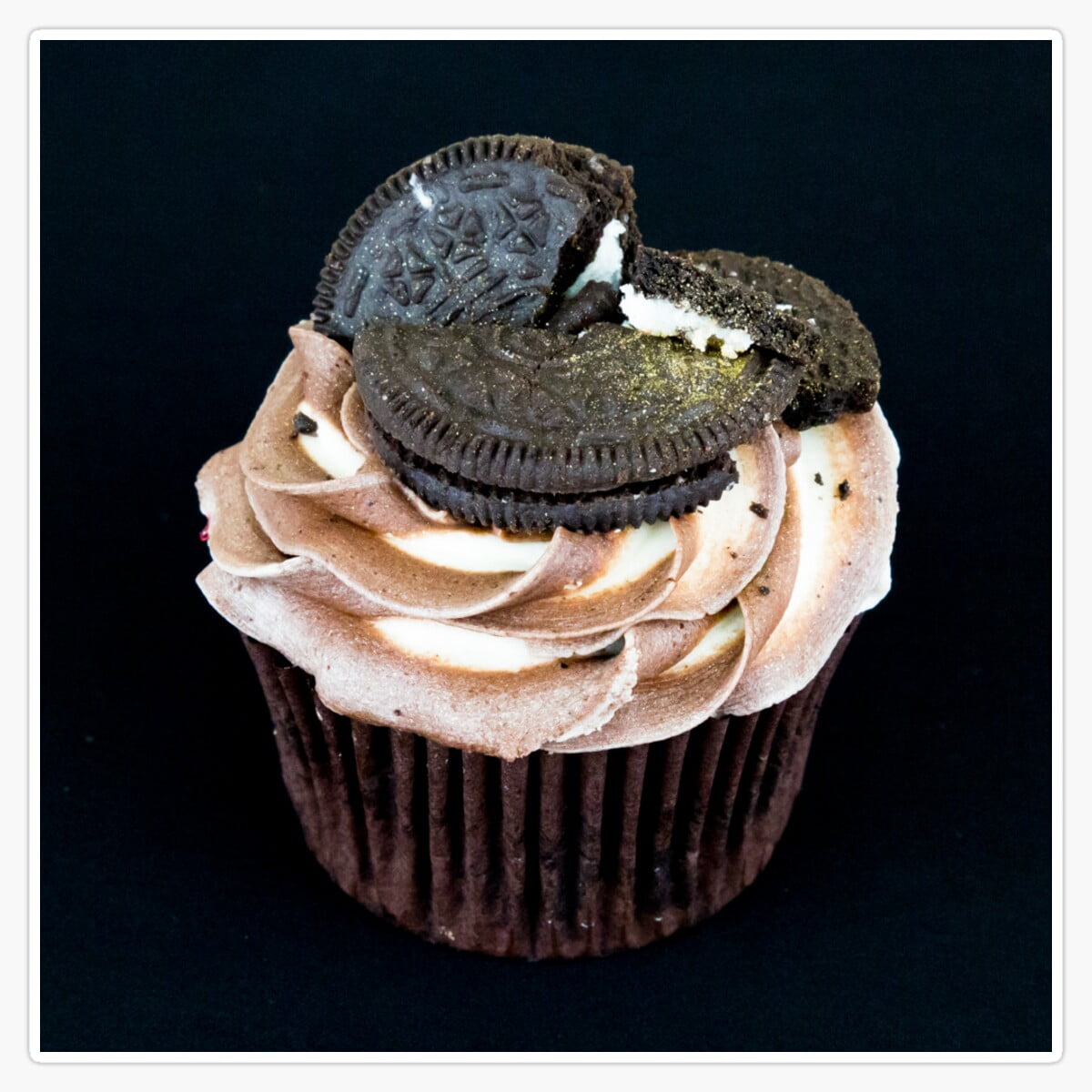 Gloss Dot Chocolate Cupcake With Crushed Biscuits On A Stylish Black ...