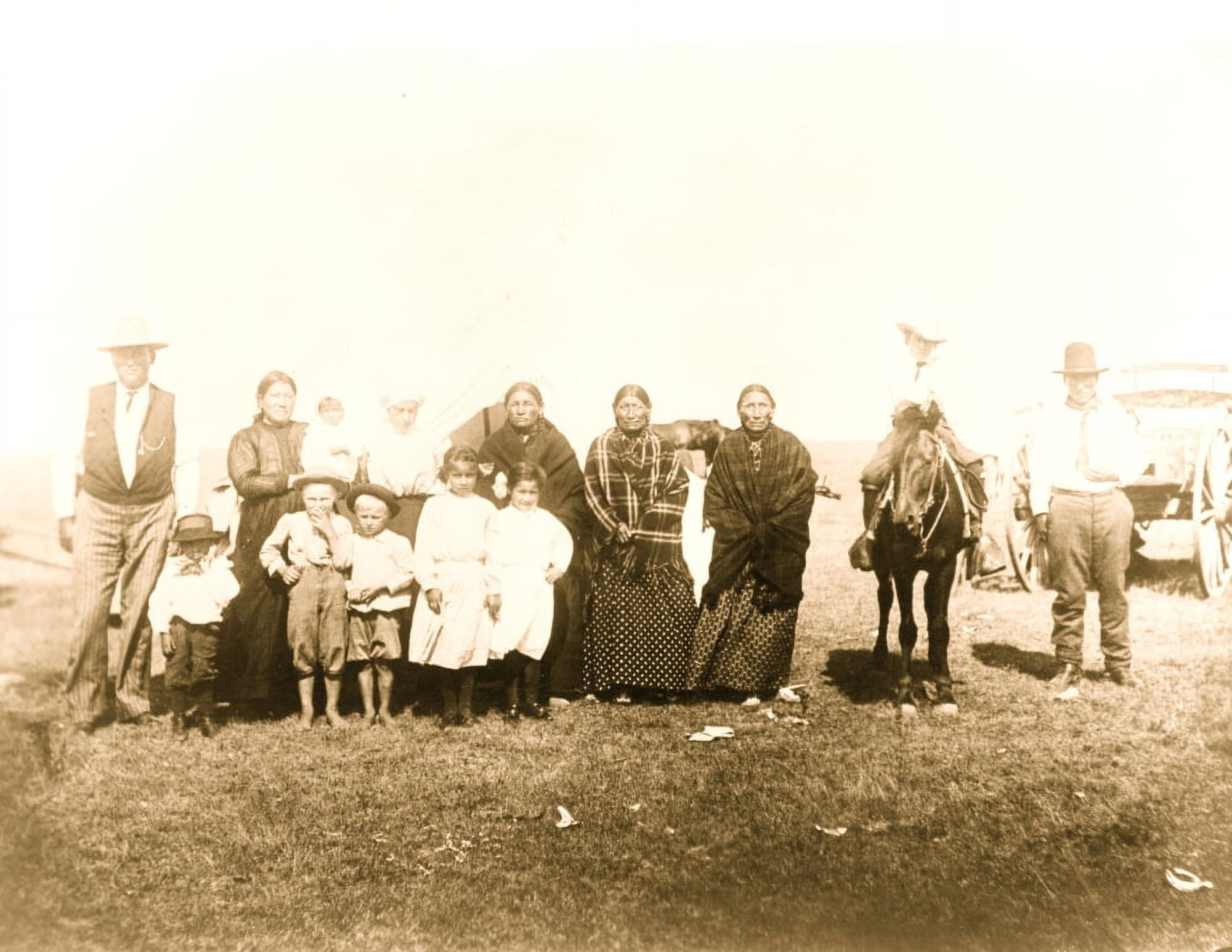 Group of Kickapoo Indians, standing outside tent, dressed in Euro ...