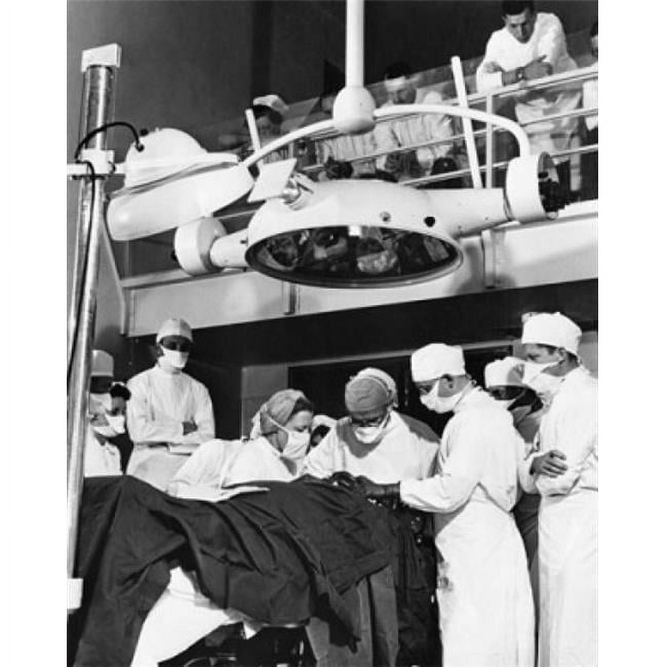 Group of Surgeons Performing an Operation in an Operating Room While ...