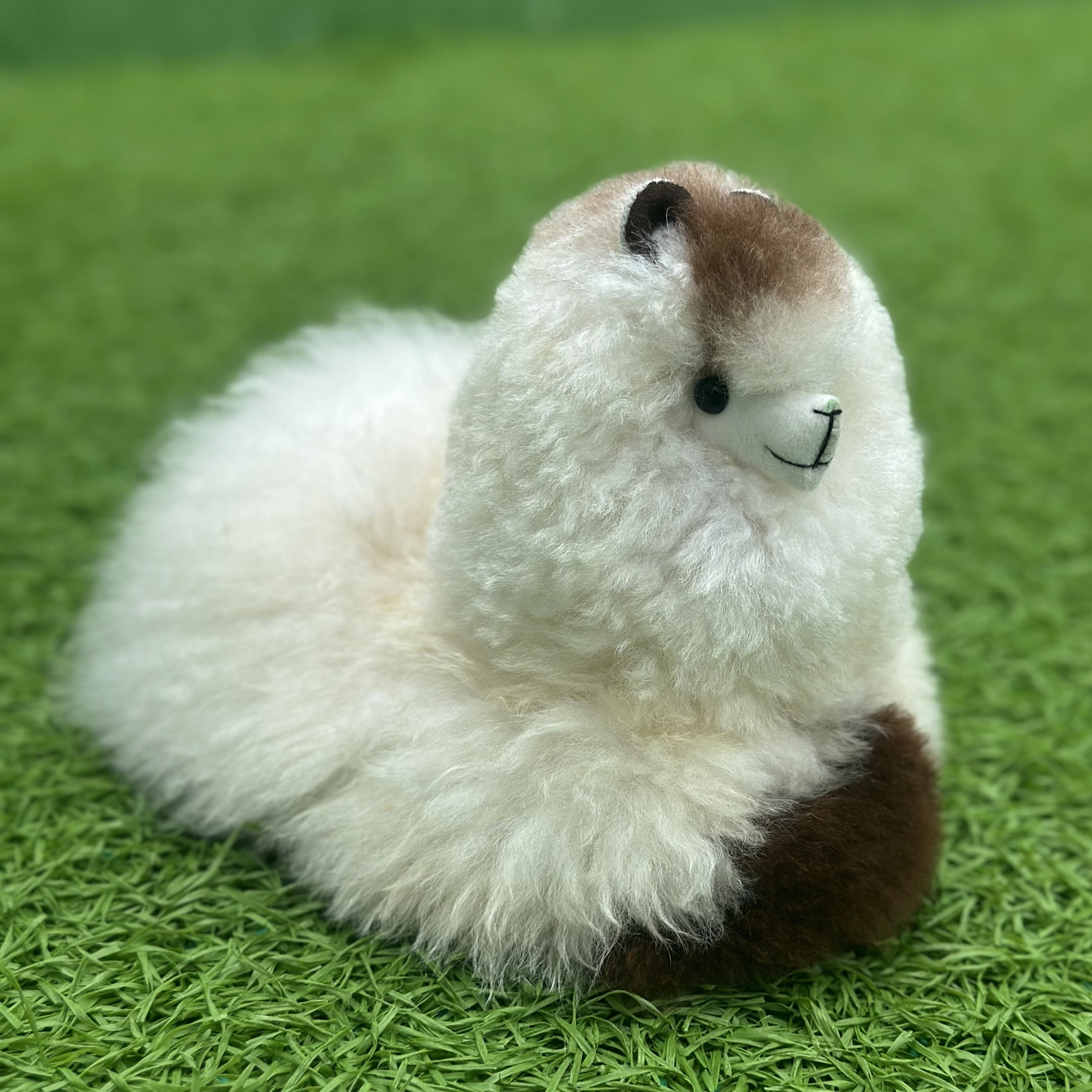 Handmade plush alpaca doll in a lying position; cute and fun gift ...