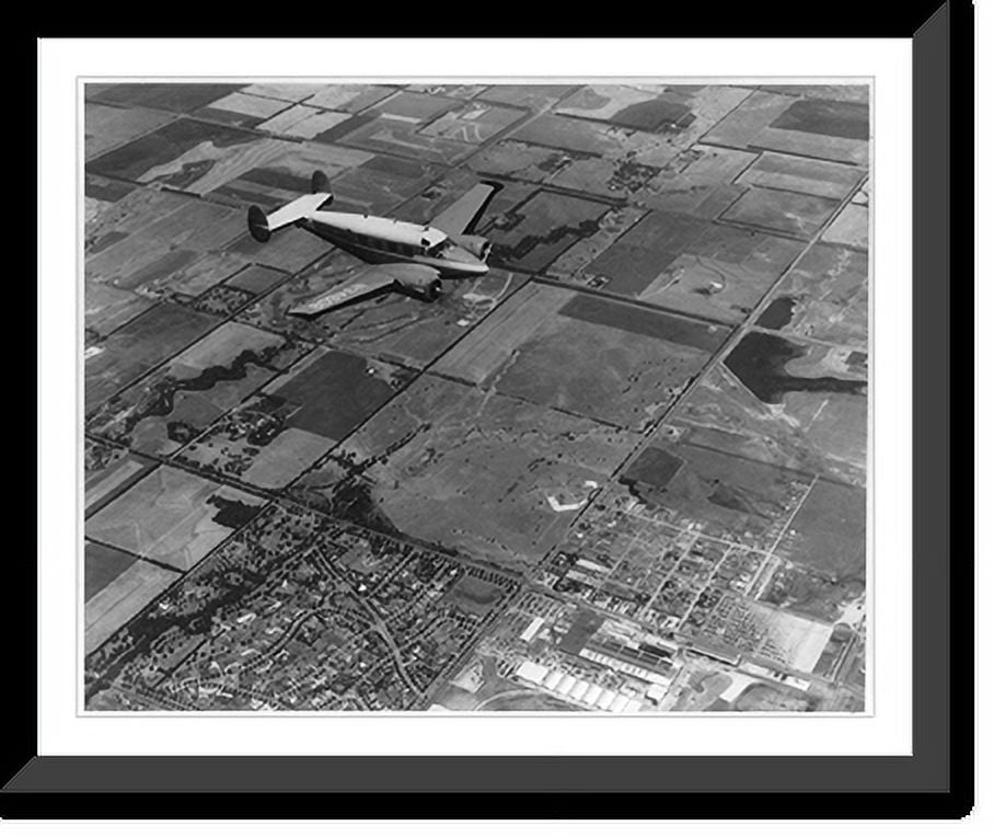 Historic Framed Print, [Aerial view of Beechcraft Super 18 airplane in ...