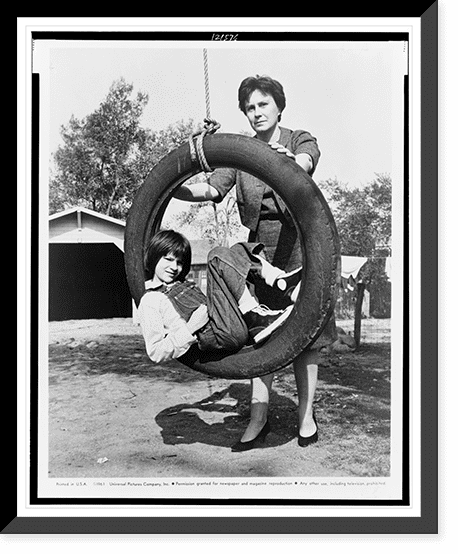 Historic Framed Print, [Author Harper Lee holding large tire swing with ...