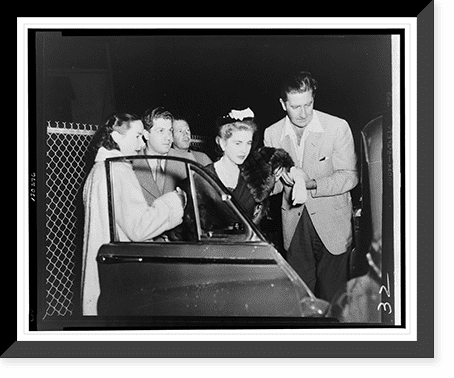 Historic Framed Print, [Barbara Hutton being helped into car by friends ...