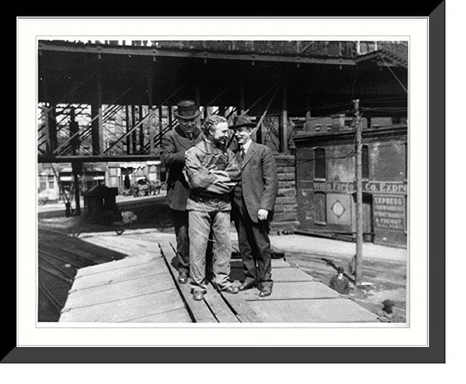 Historic Framed Print, Harry Houdini in straight jacket on railroad car ...