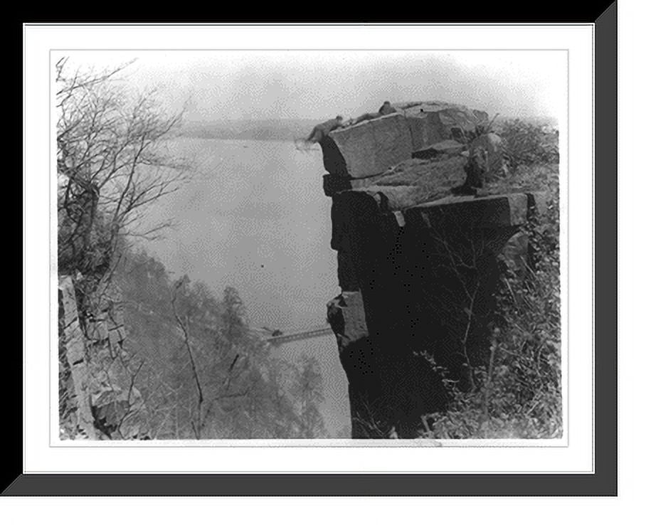 Historic Framed Print, [Houdini clinging to edge of cliff in scene from ...
