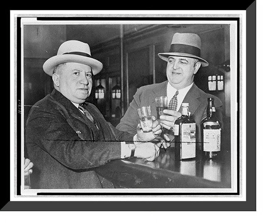 Historic Framed Print, Izzy Einstein (l) sharing a toast with Moe Smith ...