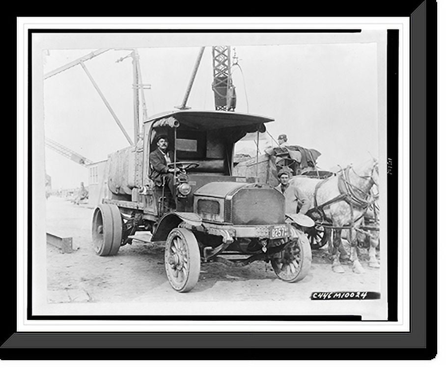 Historic Framed Print, [Mack truck, workers, and horses at a ...