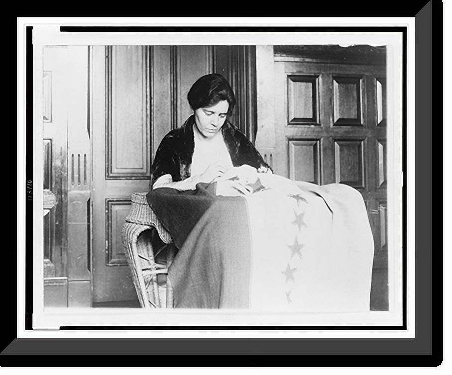 Historic Framed Print, Miss Alice Pavl is shown sewing the thirty-sixth ...