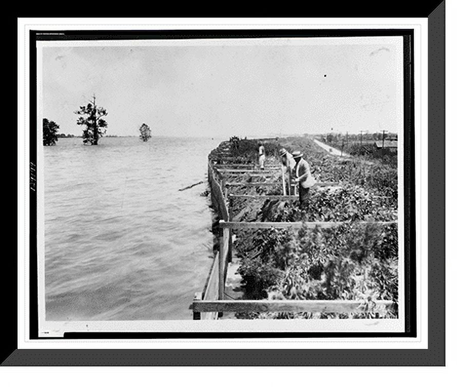 Historic Framed Print, [Plank wall holds back flood waters, people on ...