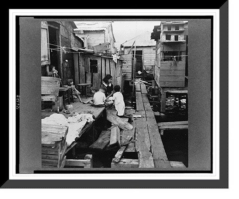 Historic Framed Print, Shacks built over tidal swamp in the workers ...
