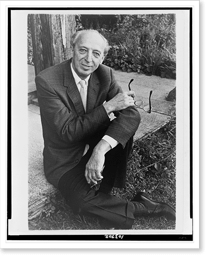 Historic Print, [Aaron Copland, full-length portrait, seated, outdoors ...
